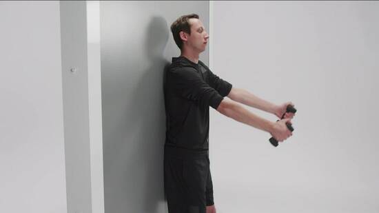 Standing Front Shoulder Raises With Dumbbells With Thumbs Up ...